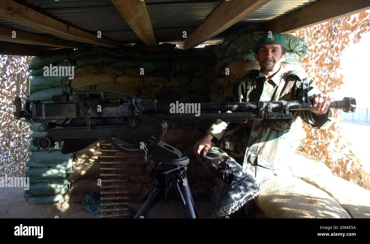Afghan National Army Sergeant Syeed Din mans a heavy machine gun at ...