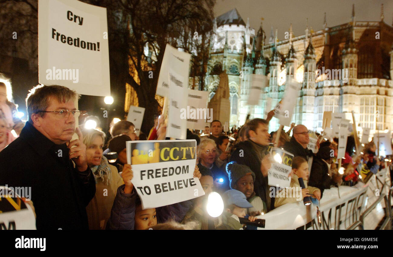 A group of adults and children sing during a protest in Parliament ...