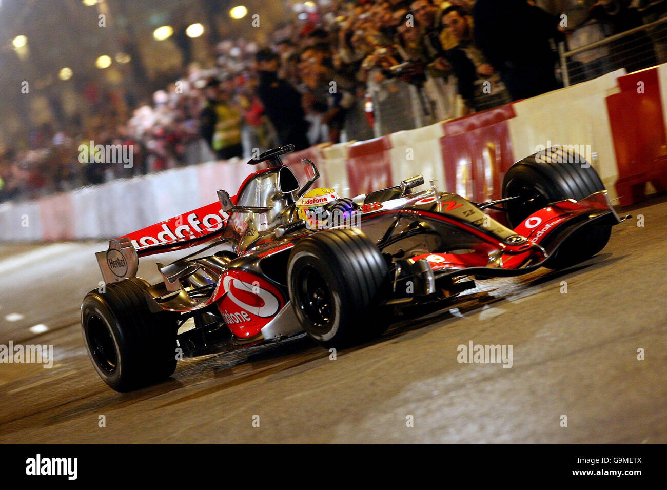 Lewis Hamilton drives his Vodafone McLaren Mercedes around the streets ...