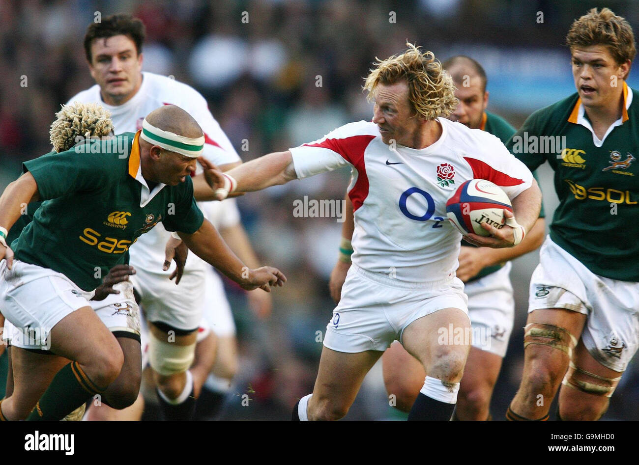 England's Peter Richards hands off South Africa's Ricky Januarie during ...
