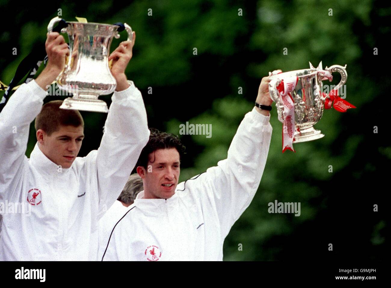 Robbie fowler who holds up worthington cup trophy hi-res stock ...