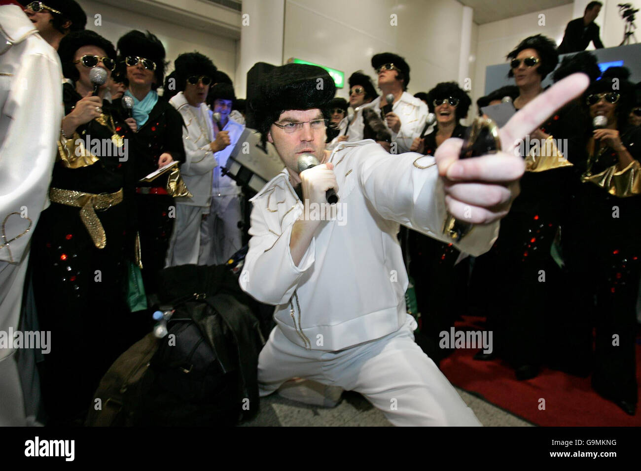 109 Elvis impersonators perform at Gatwick Airport to create a new ...
