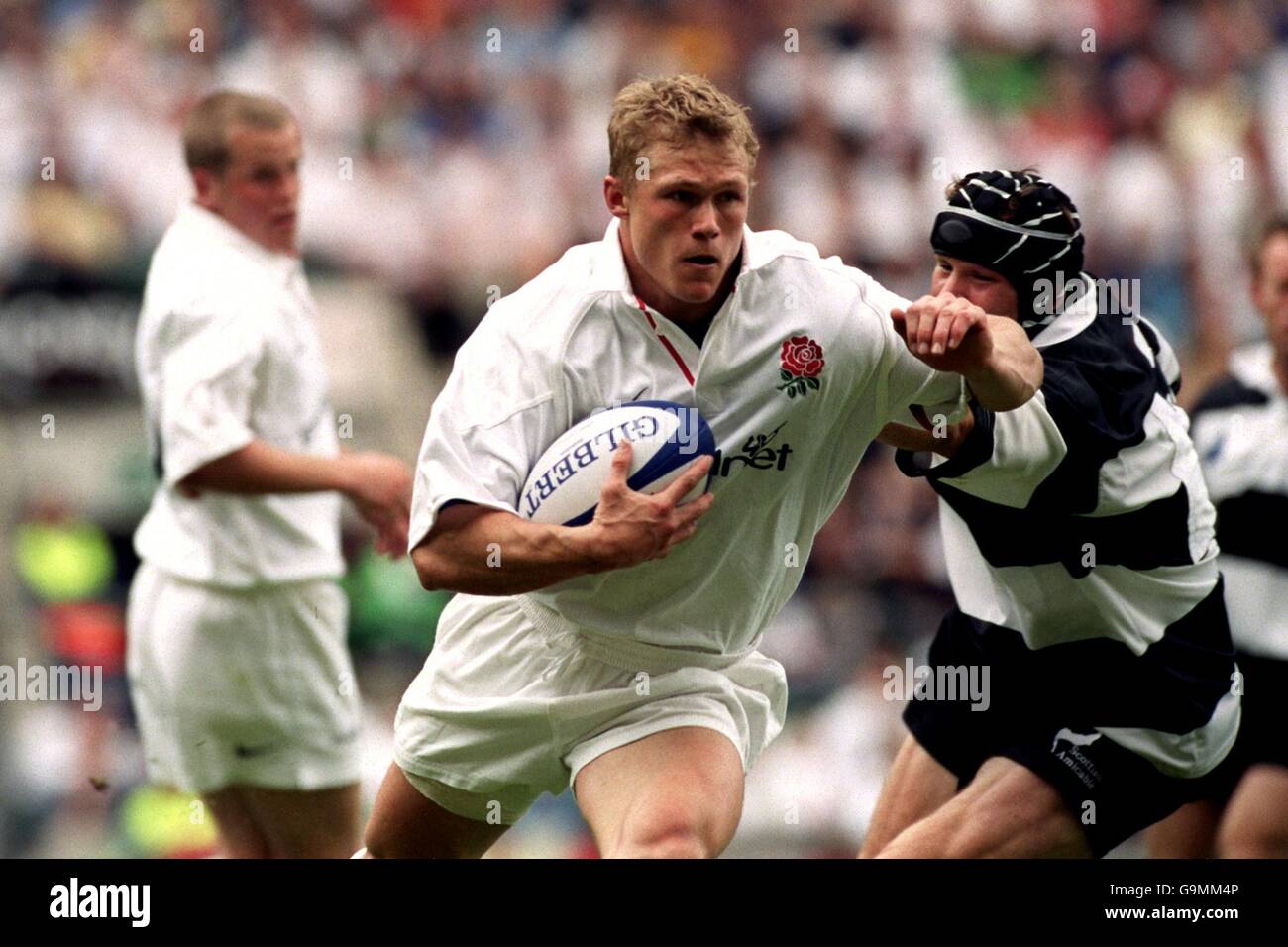 Barbarians' Josh Kronfeld makes a tackle on England's Josh Lewsey Stock ...