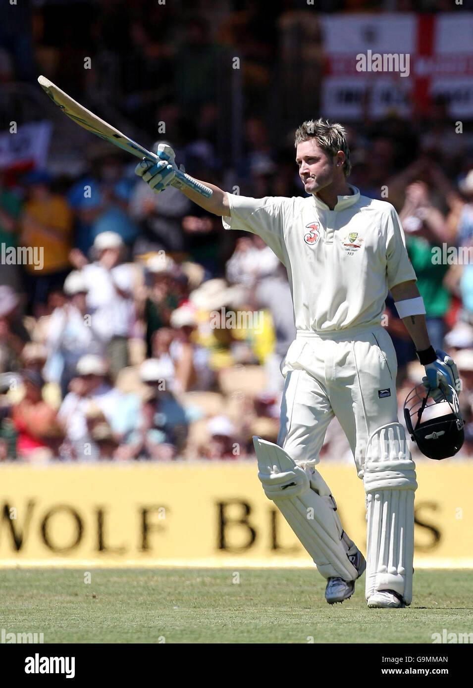 Australia's Michael Clarke salutes the crowd after reaching his century ...