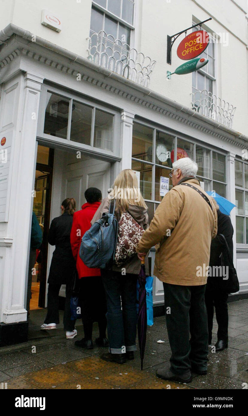 Customers queue outside the post office in lewes hi-res stock ...