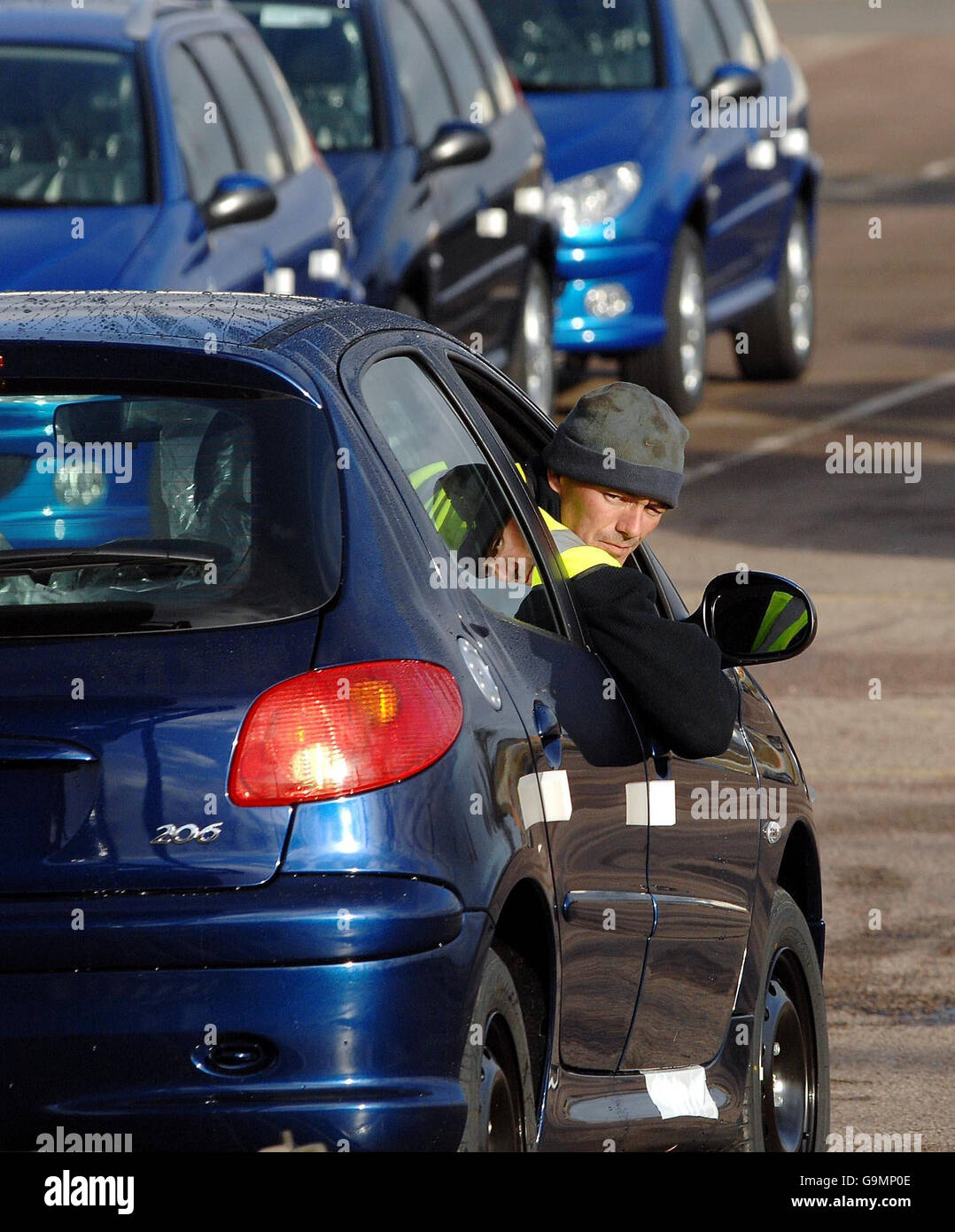 New cars are loaded on to transporters at the Peugeot's Ryton Plant ...