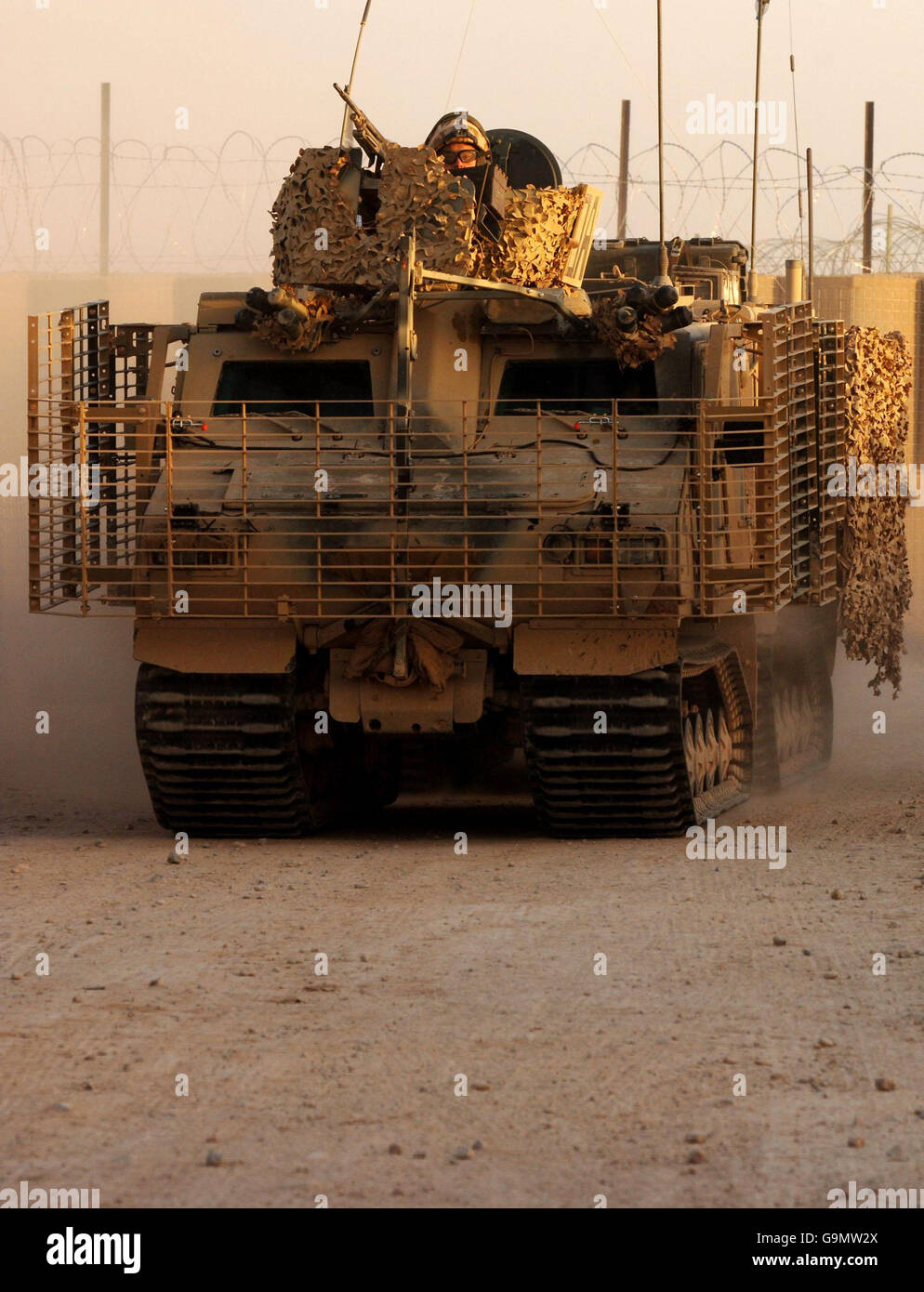 A Royal Marine Commando Viking personnel carrier drives into FOB Price ...