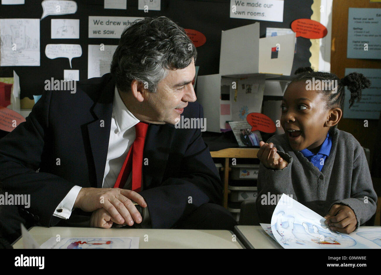 Britain's Chancellor of the Exchequer Gordon Brown sits with children ...