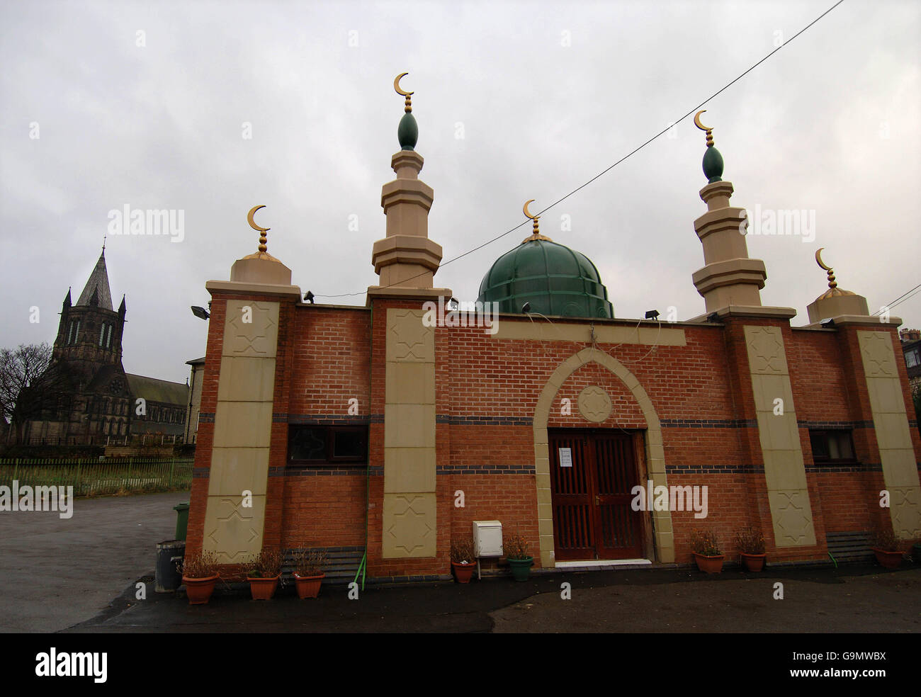 Side by side: a church and mosque in the Armley area of Leeds Stock ...