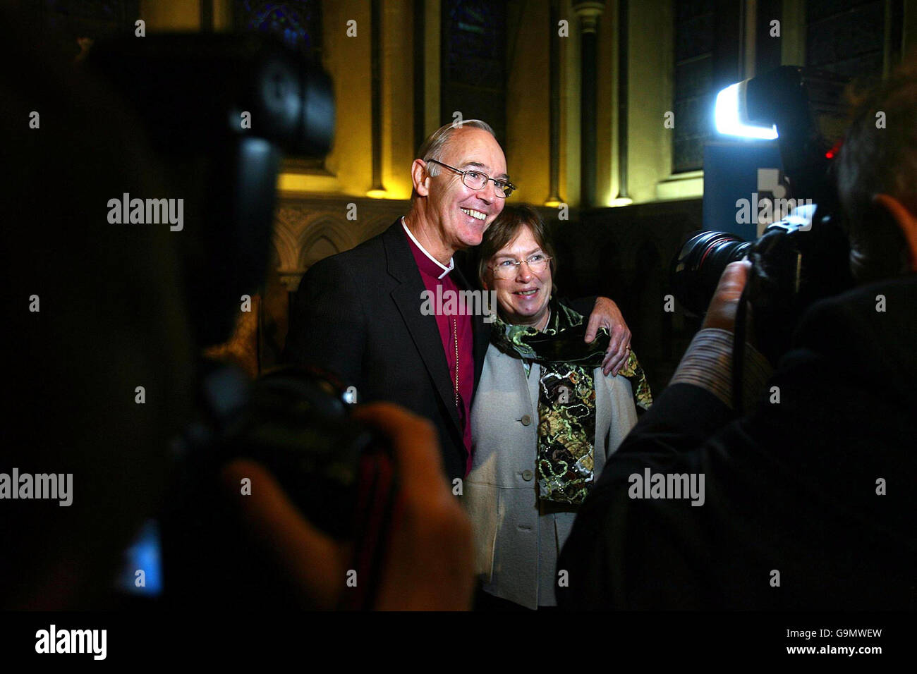 The Bishop of Connor, the Rt Rev Alan Harper, stands with his wife ...