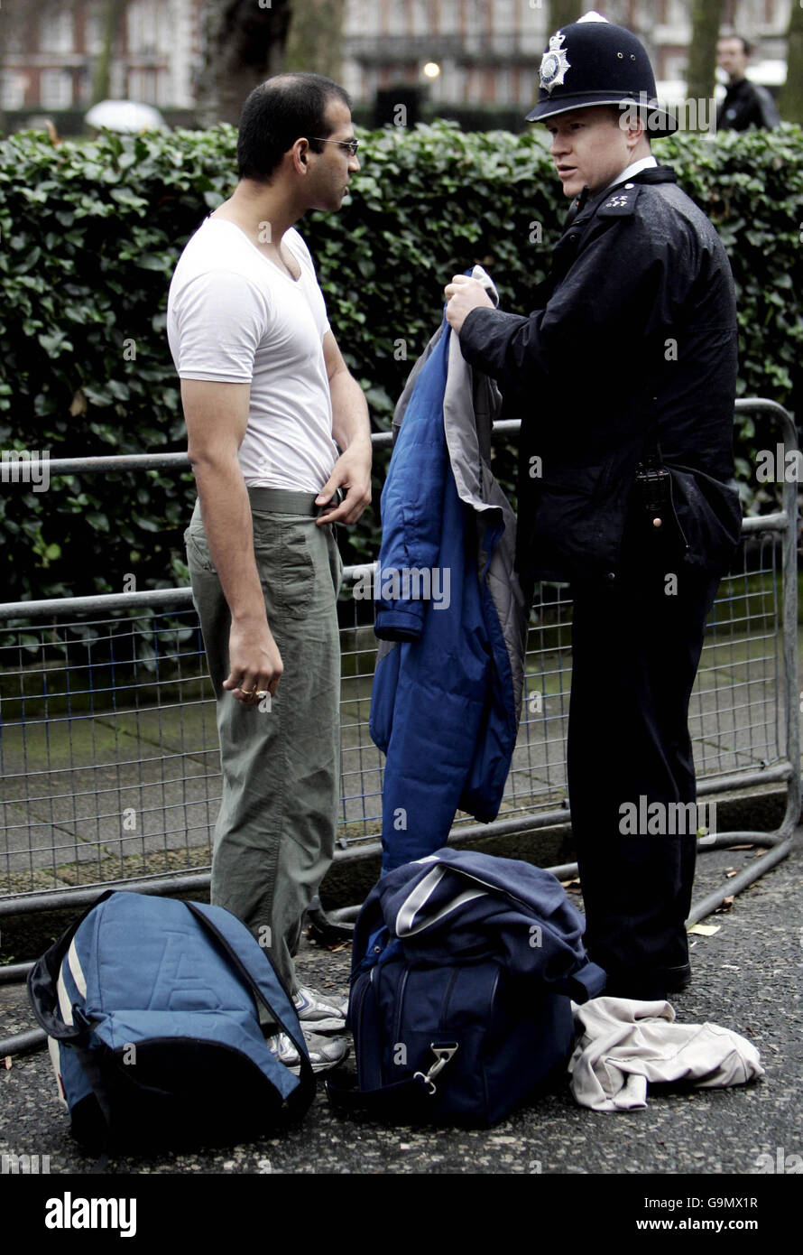 Stock picture police officers searching man outside us embassy hi-res ...