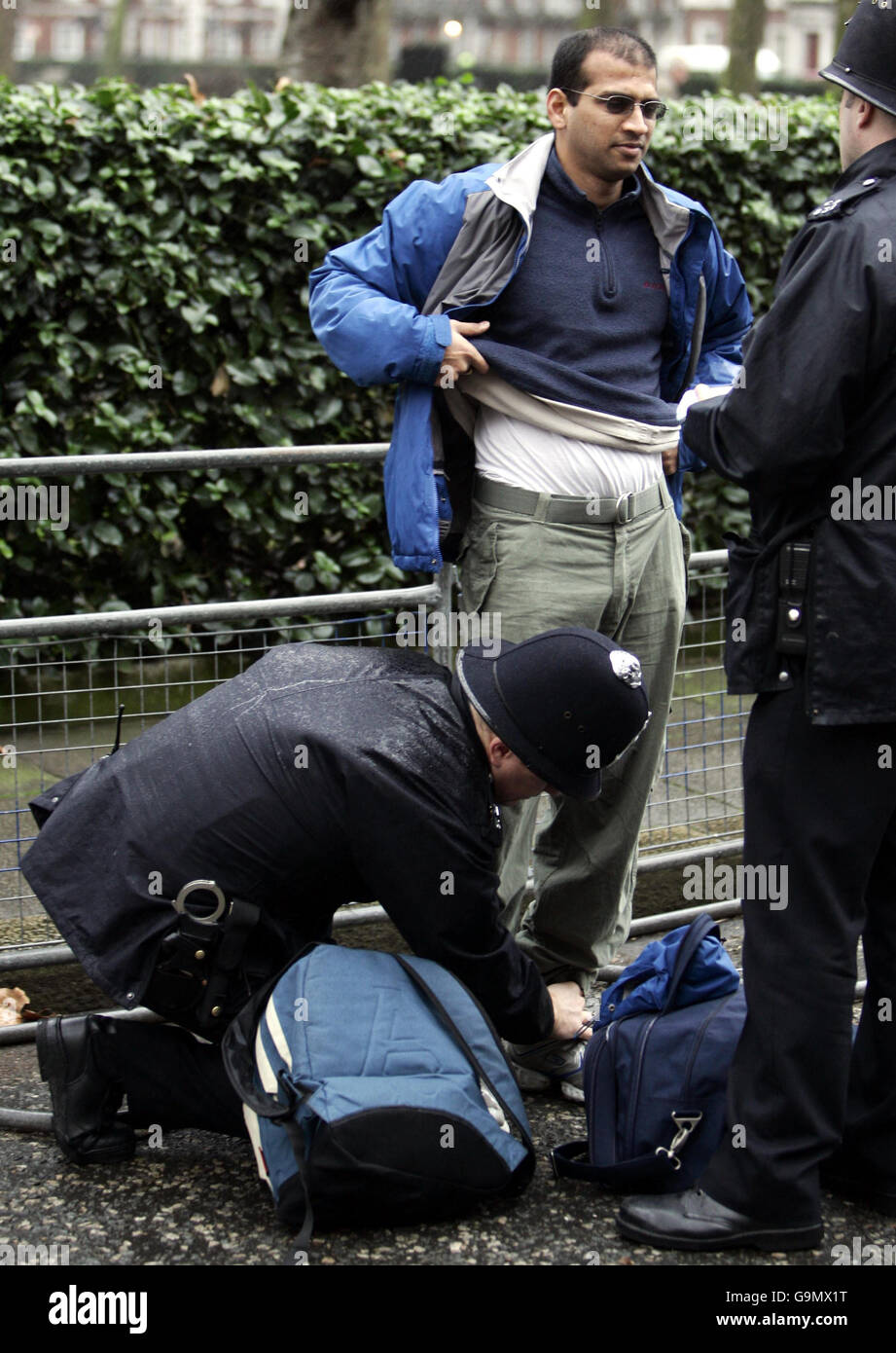 Stock picture police officers searching man outside us embassy hi-res ...