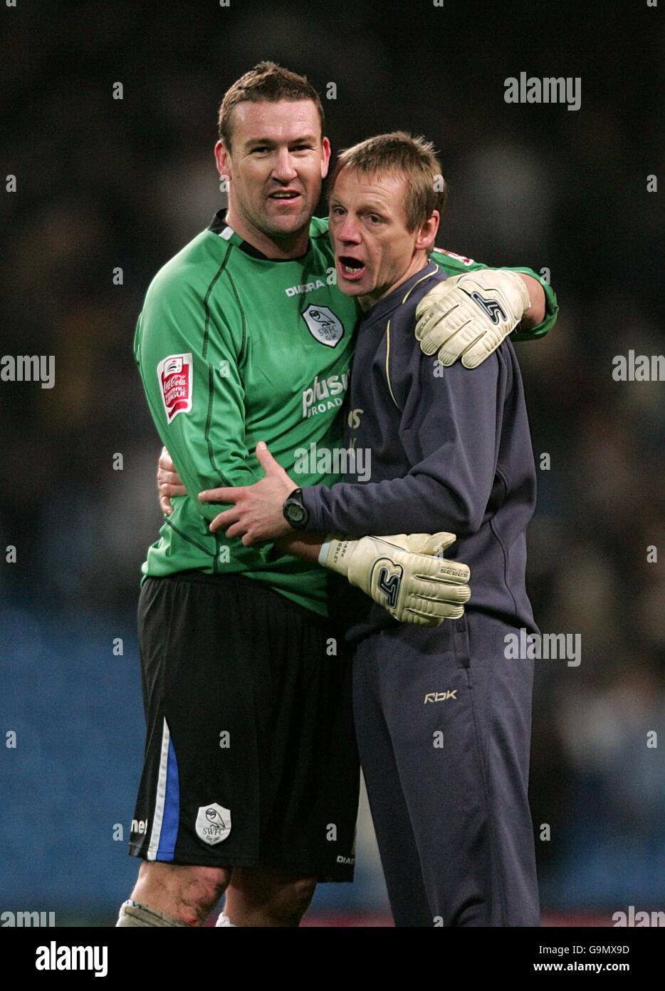 Sheffield Wednesday goalkeeper Mark Crossley (left) embraces his old ...