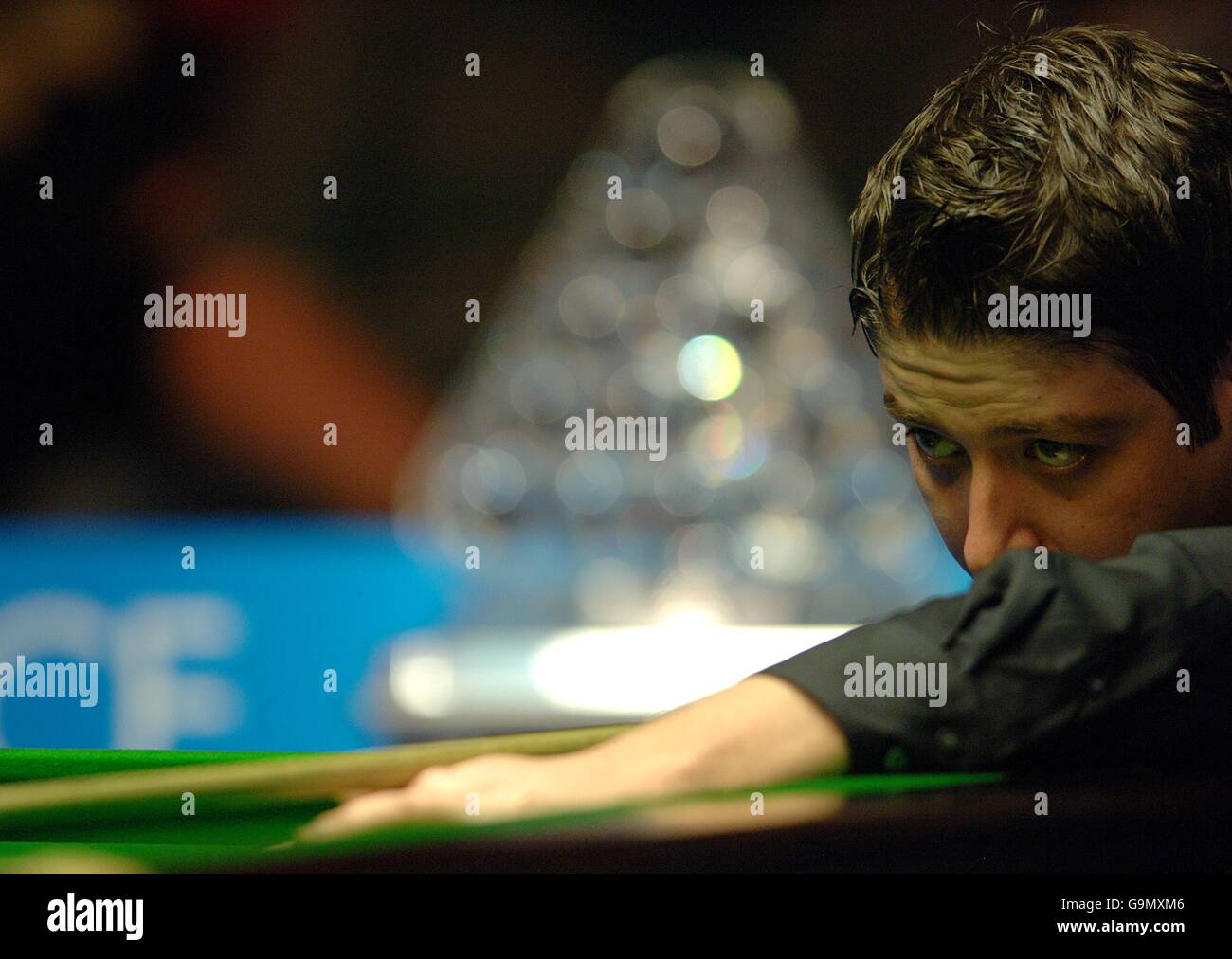 Matthew Stevens lines up his next shot with the masters trophy in the ...