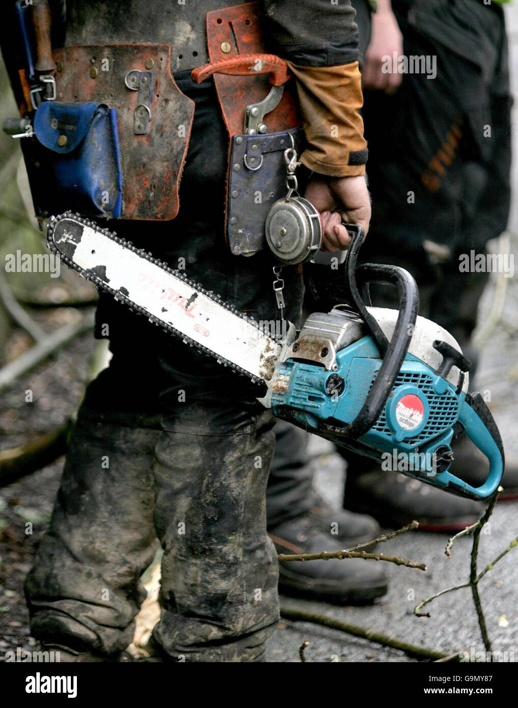 Rescue workers use chain saws to remove debrit on the B4373 in ...