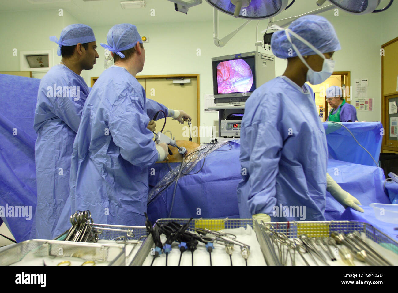 Consultant Surgeon Andrew Miles and Registrar Jim Khan perform a ...