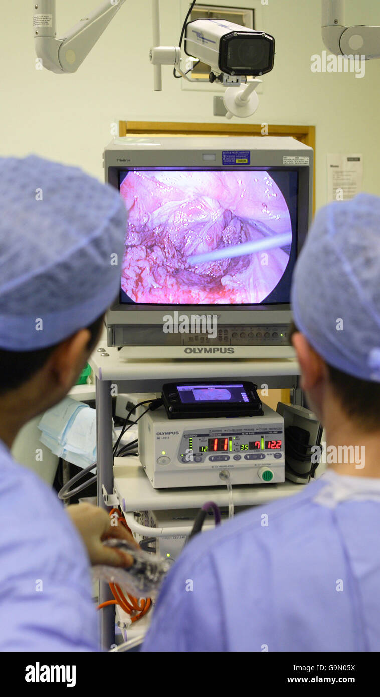 Consultant Surgeon Andrew Miles and Registrar Jim Khan perform a ...