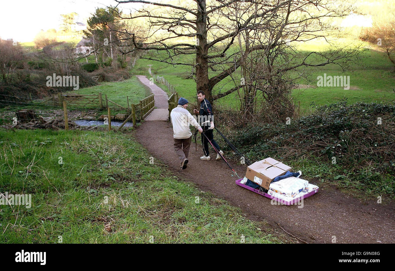 Beachcombers drag items away from Branscombe beach as the MSC Napoli ...