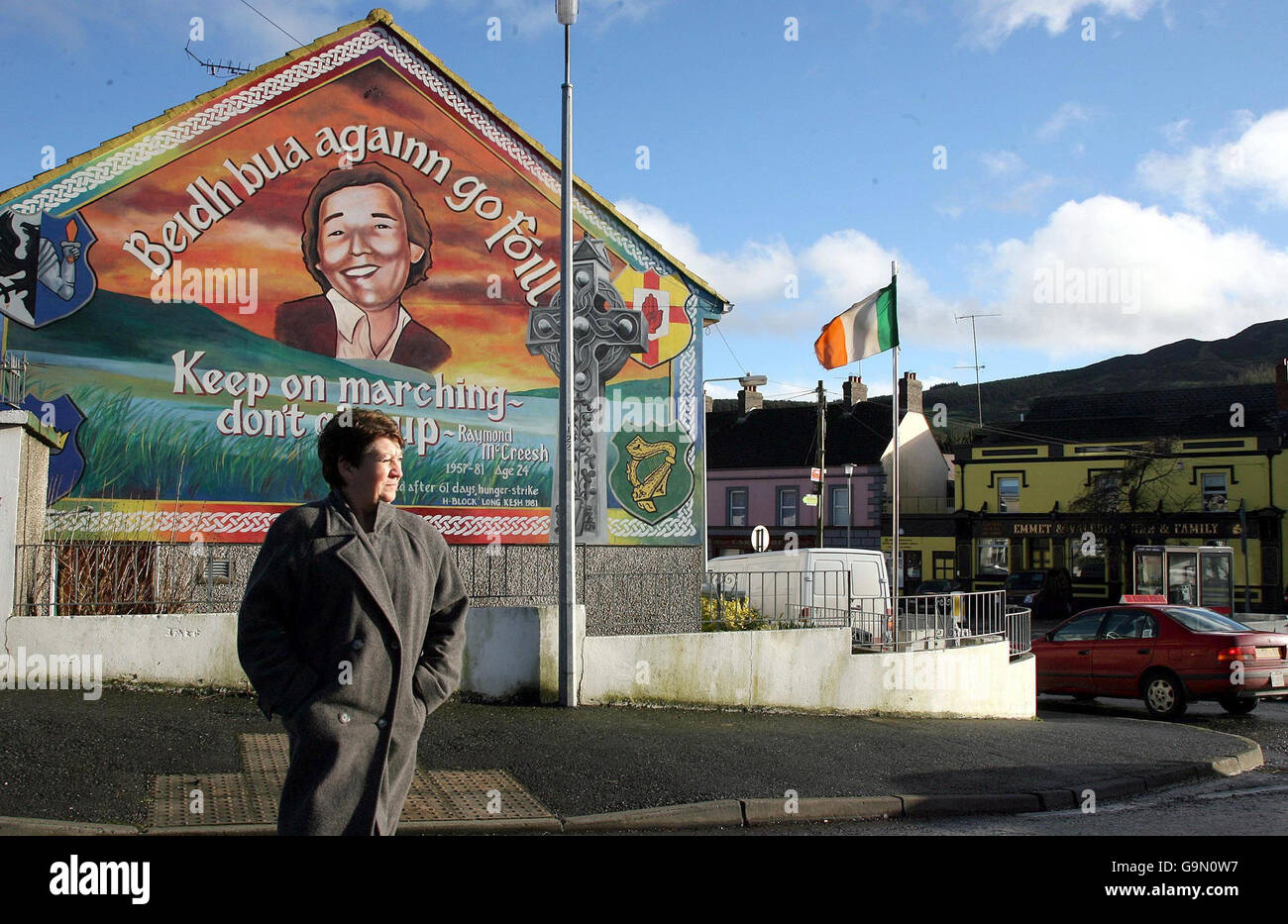 A pedestrian crosses the road in the village of Camlough in south ...