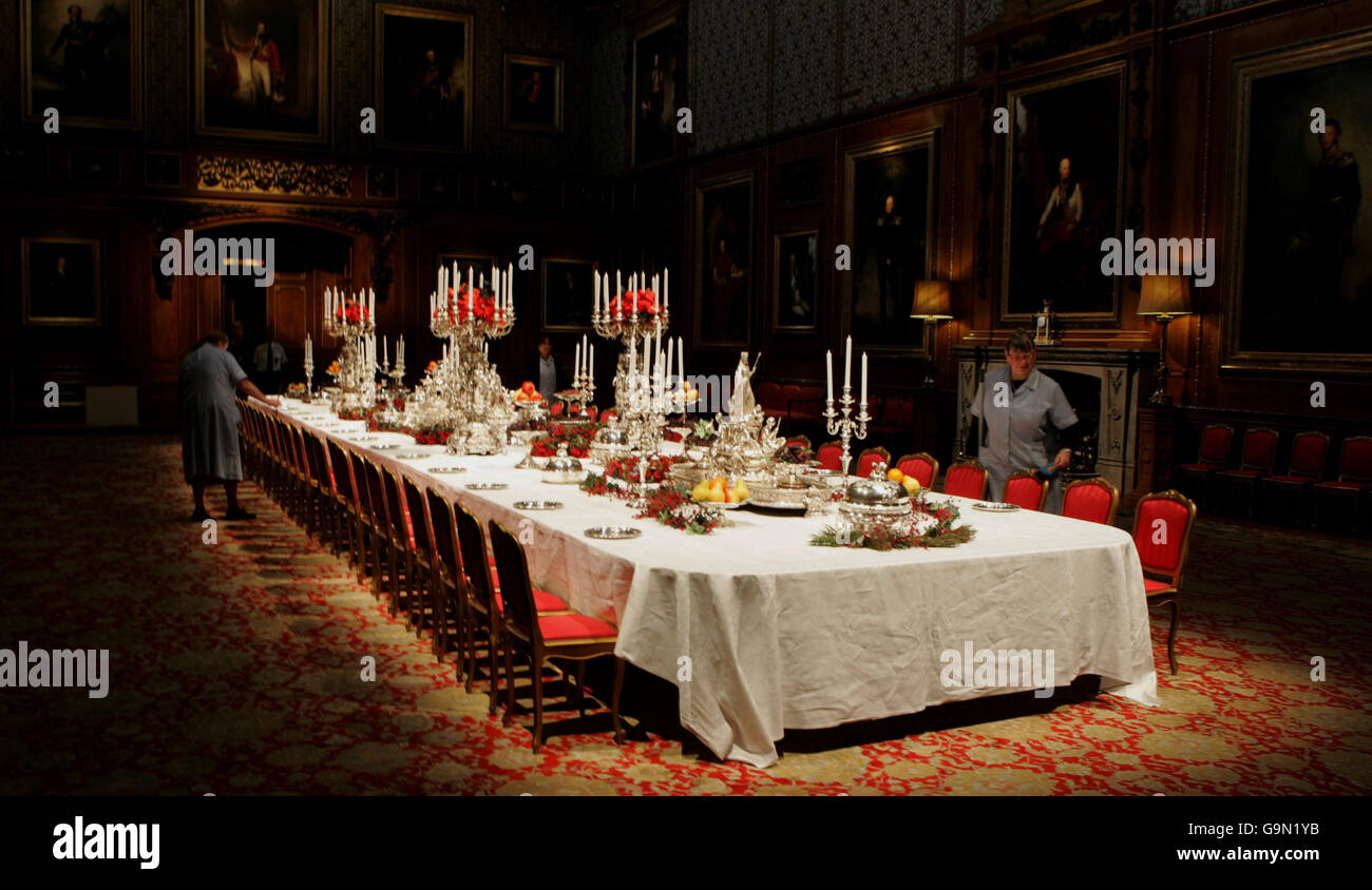 A dinner service composed of Victorian silver is dusted by members of ...