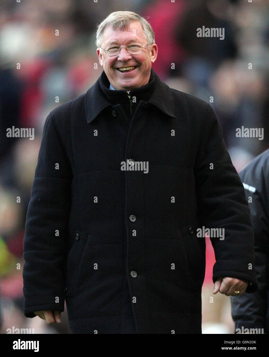 Manchester United manager Alex Ferguson smiles following their 3-1 ...