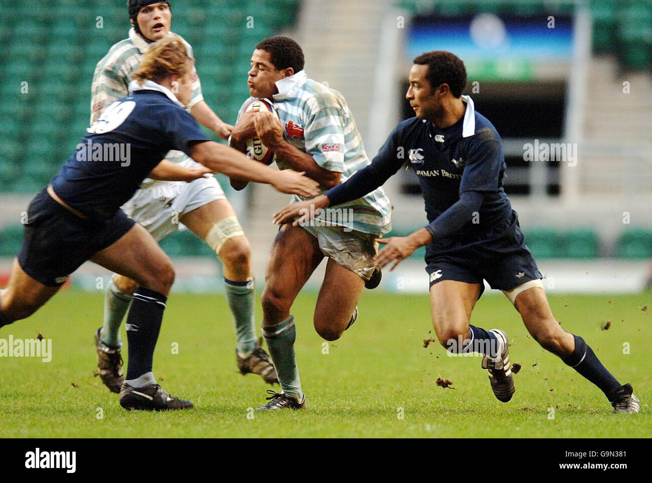 Cambirdge's Joseph Ansbro (centre) pushes past Oxford's Johan Boto ...