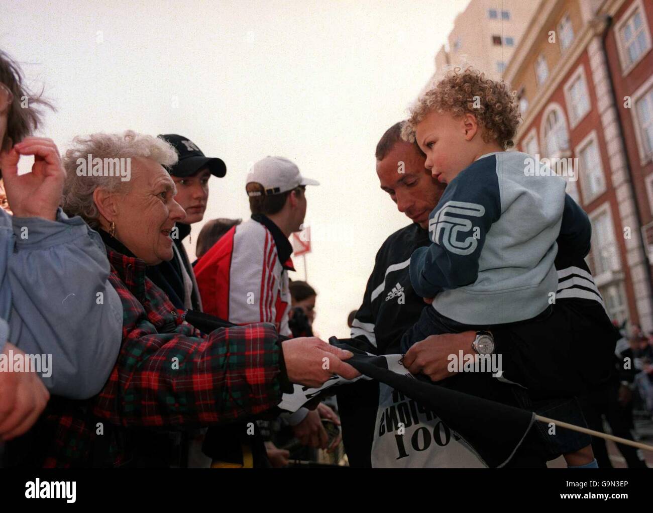Fulhams terry phelan holding his daughter signs autographs hi-res stock ...