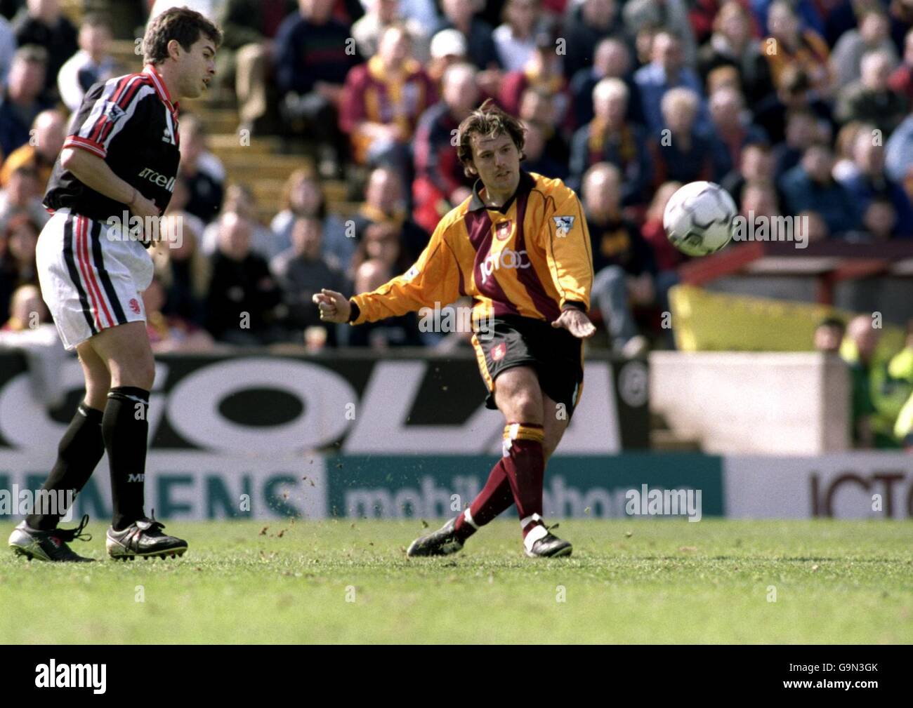 Bradford City's Robbie Blake (r) passes the ball as he is closed down ...