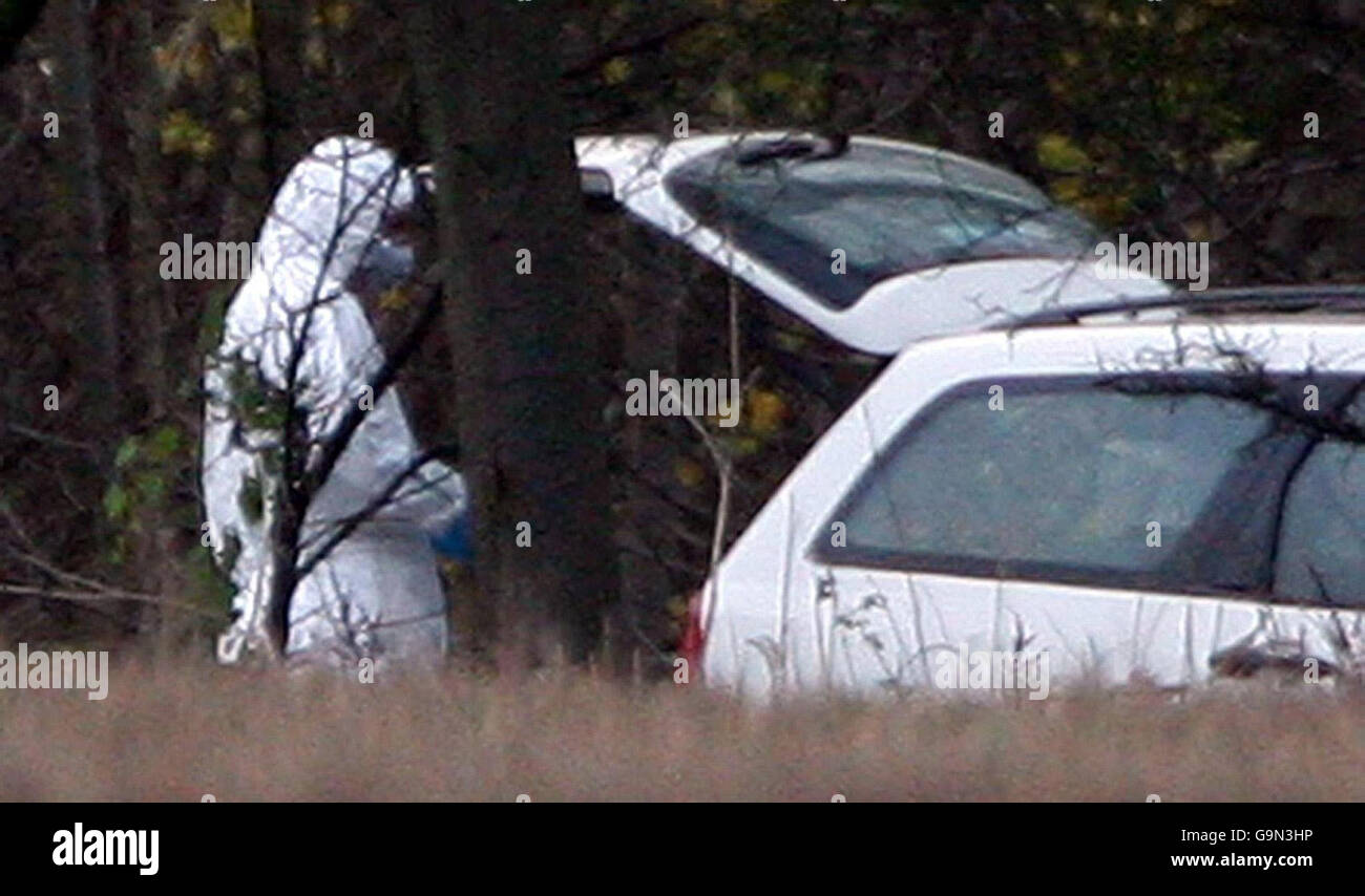 A forensic officer in the wood near Levington, Suffolk, where two ...