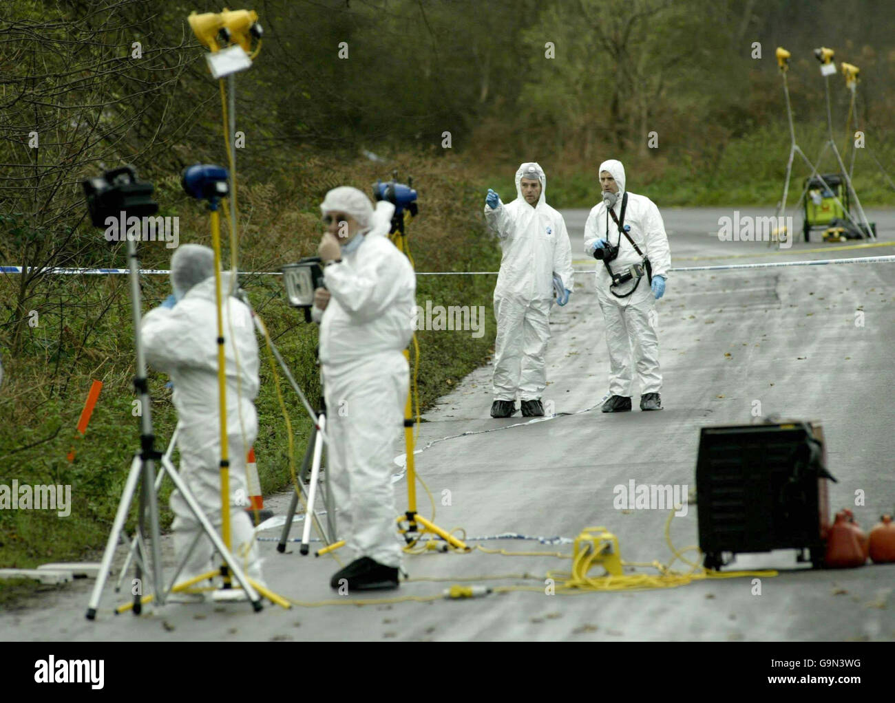 Forensic officers at the scene in Levington, Suffolk, where two bodies ...