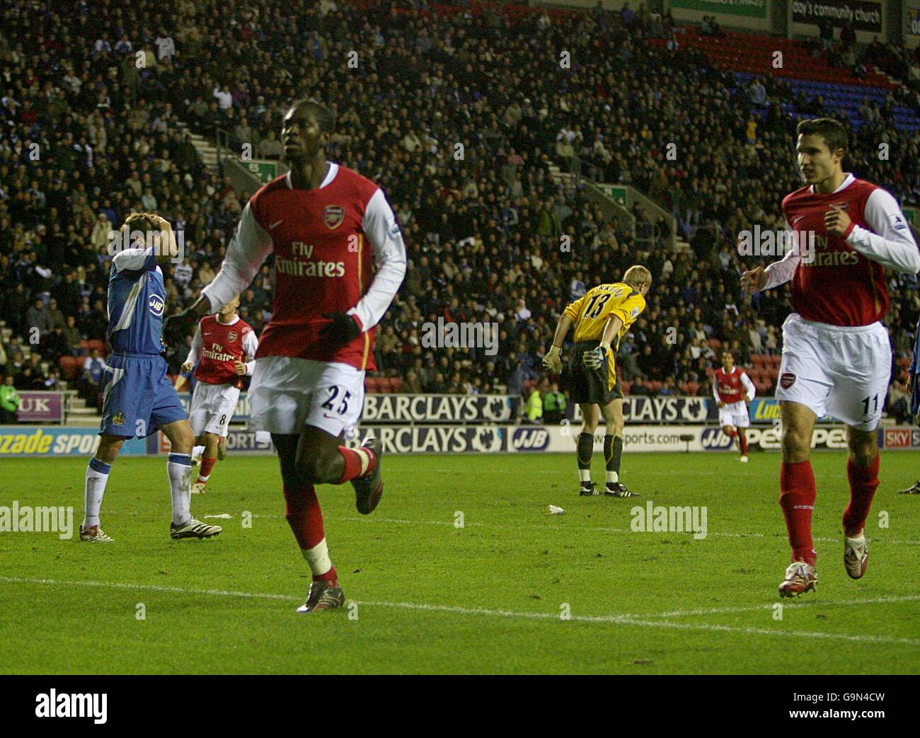Arsenal's goal scorer Emmanuel Adebayor celebrates his goal with Robin ...