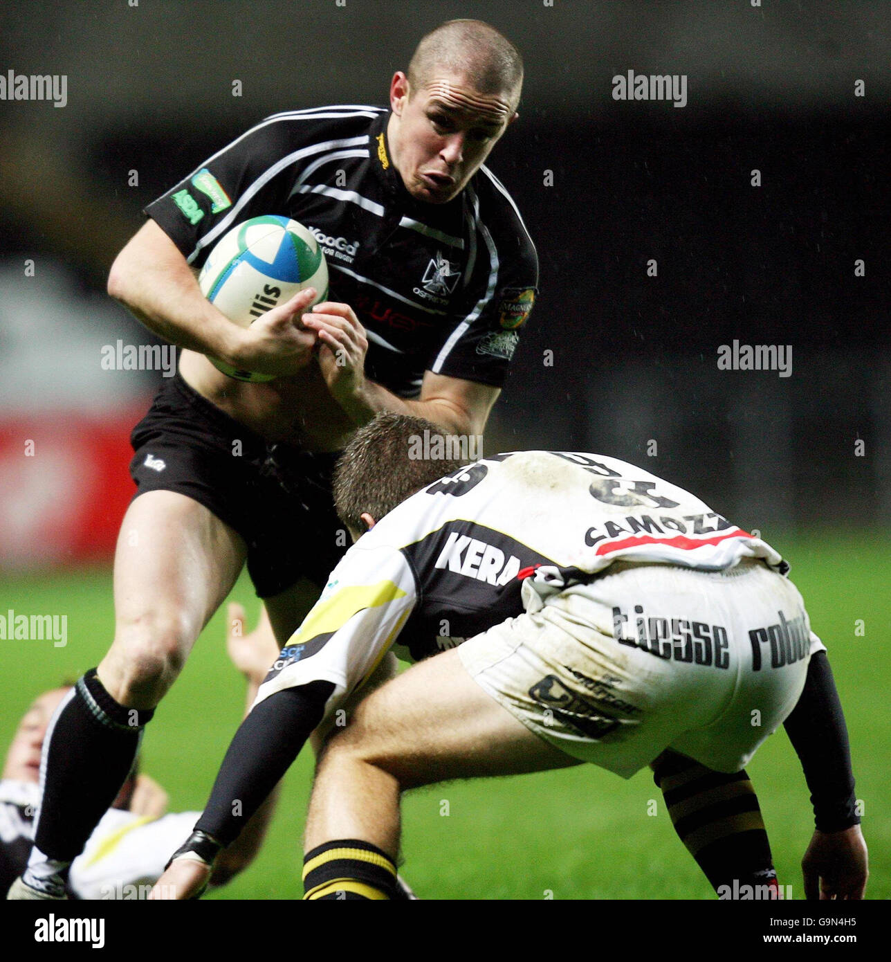 Full length tackiling ball action mangpb hi-res stock photography and ...