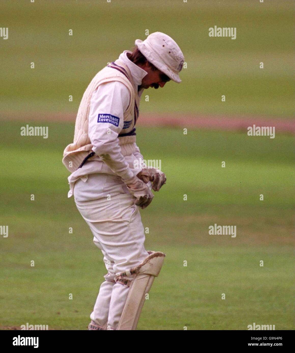 Gloucestershire's wicket Keeper Jack Russell adjusts himself after his ...