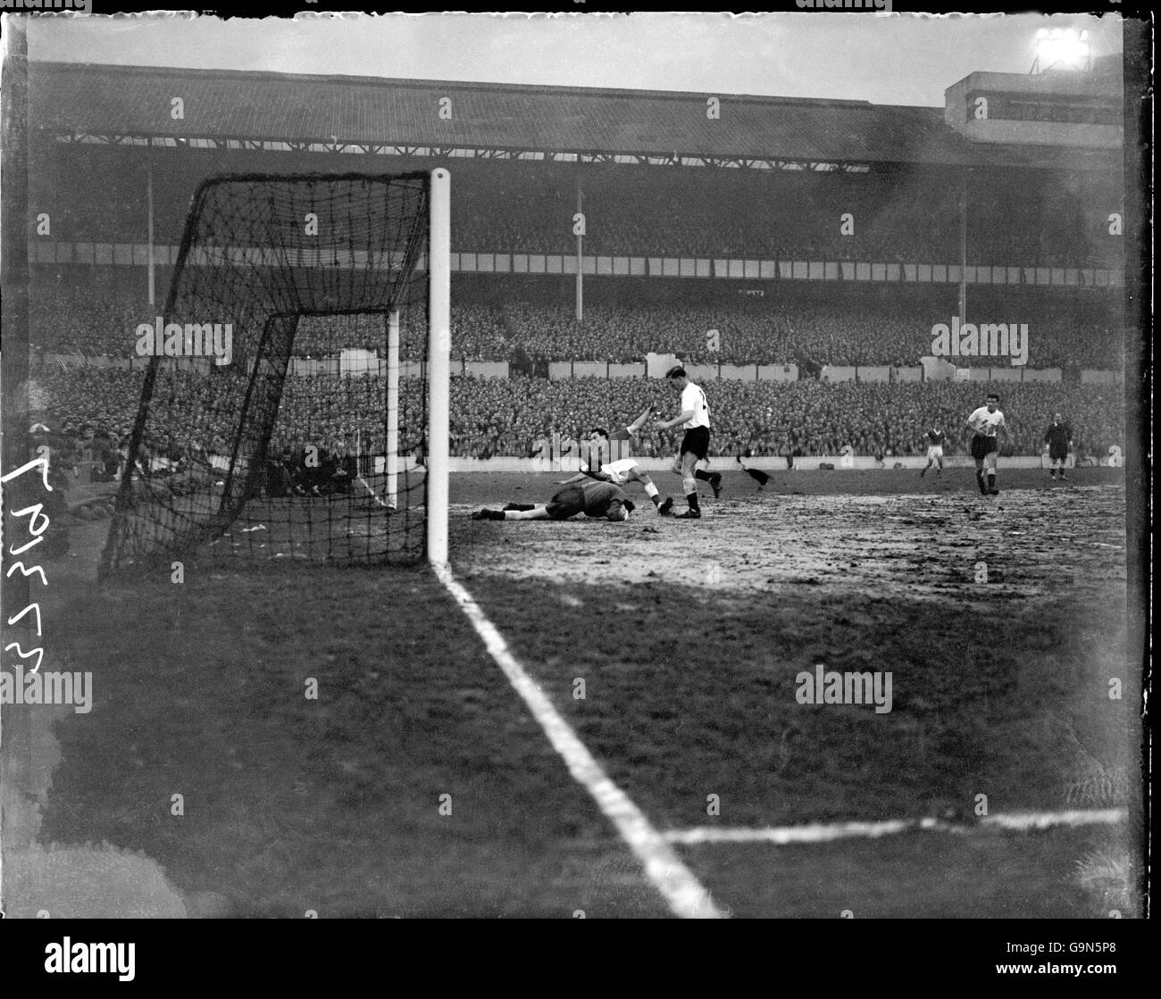 (L-R) Tottenham Hotspur goalkeeper Bill Brown saves from Charlton ...