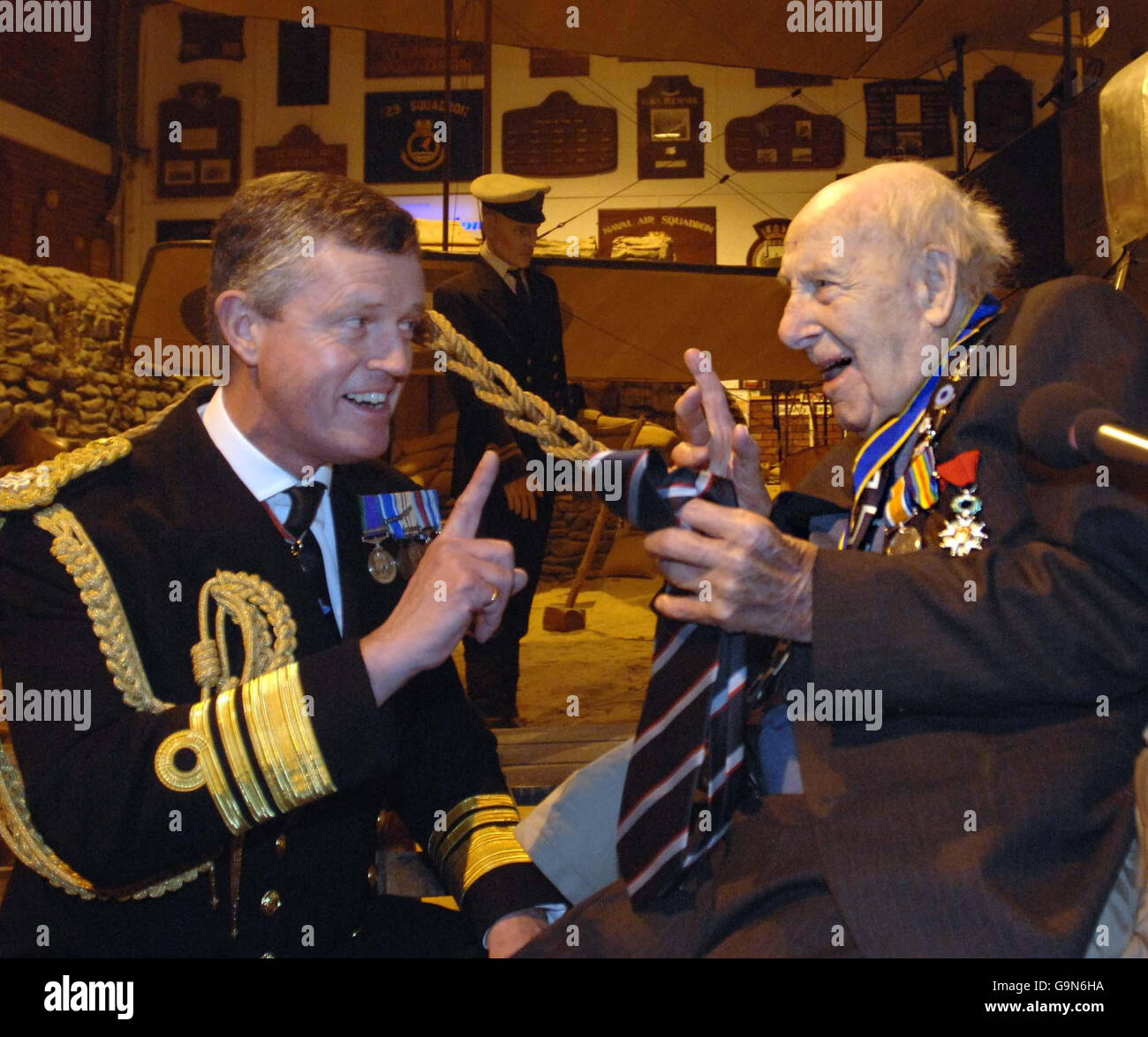 110 year old Henry Allingham shares a joke with Vice Admiral Adrian ...
