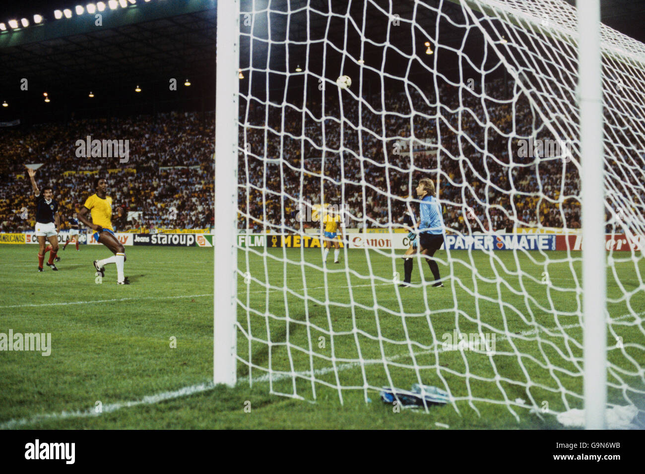 Brazil's Eder (second r) chips the ball over Scotland goalkeeper Alan ...