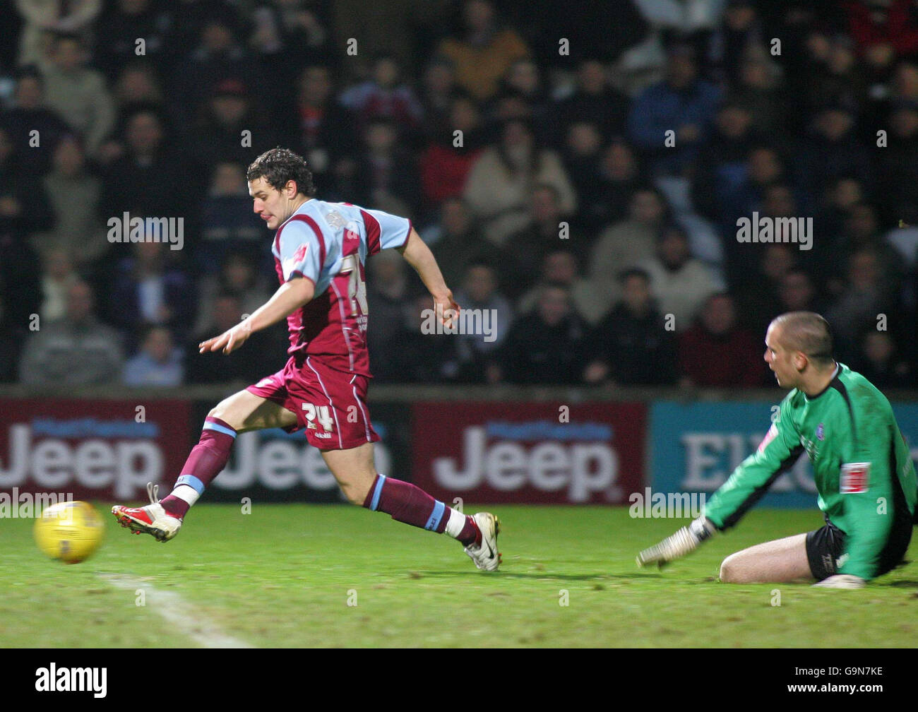 Scunthorpe United's Billy Sharp (left) gets past Chesterfield United's ...