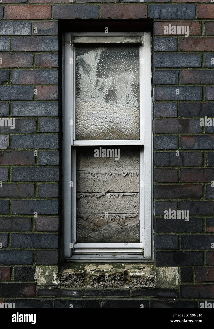 A bricked up window in a residential home in Denny town centre. The ...