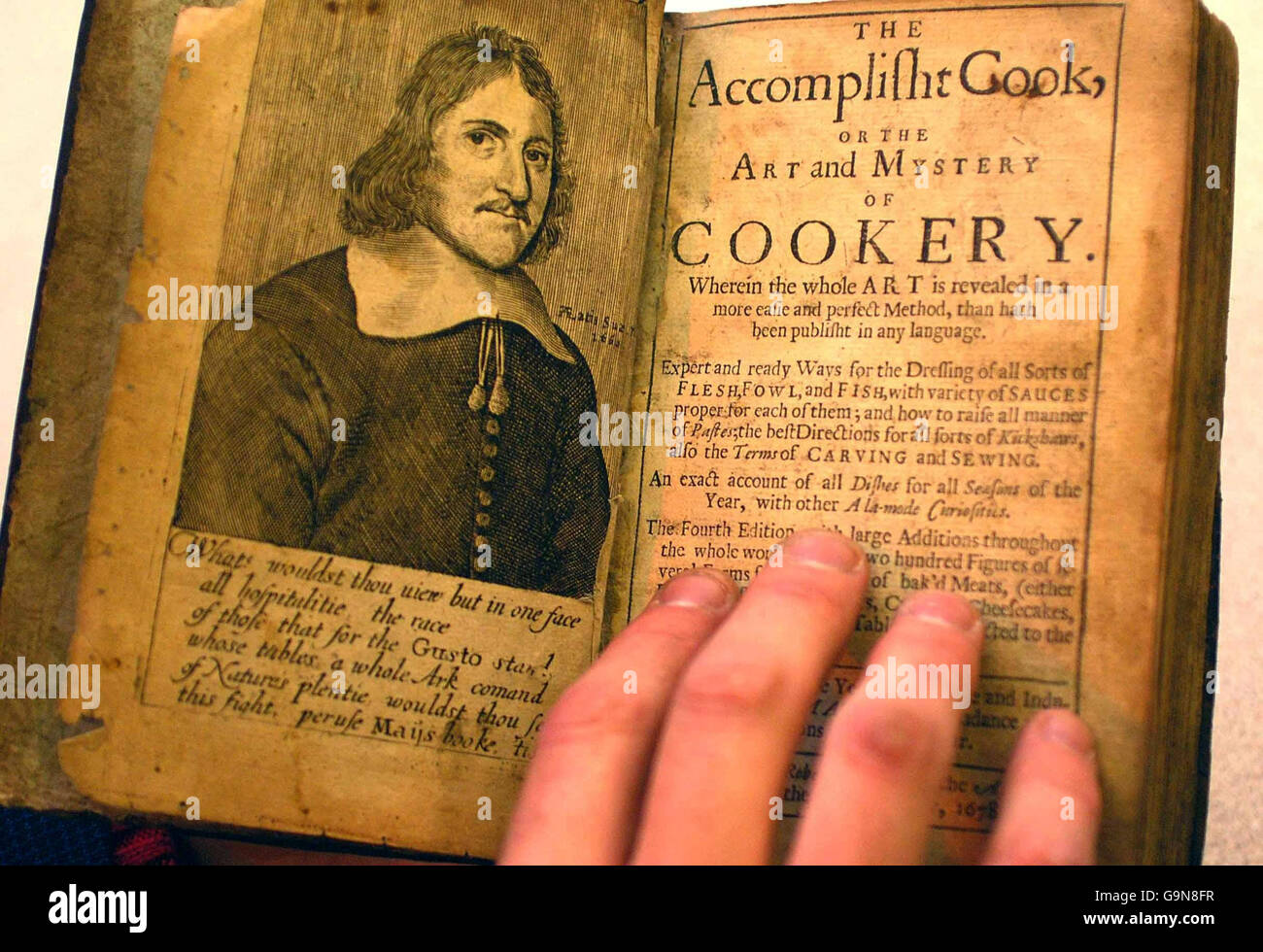 Tv auctioneer charles hanson holds open the accomplished cook hi-res ...