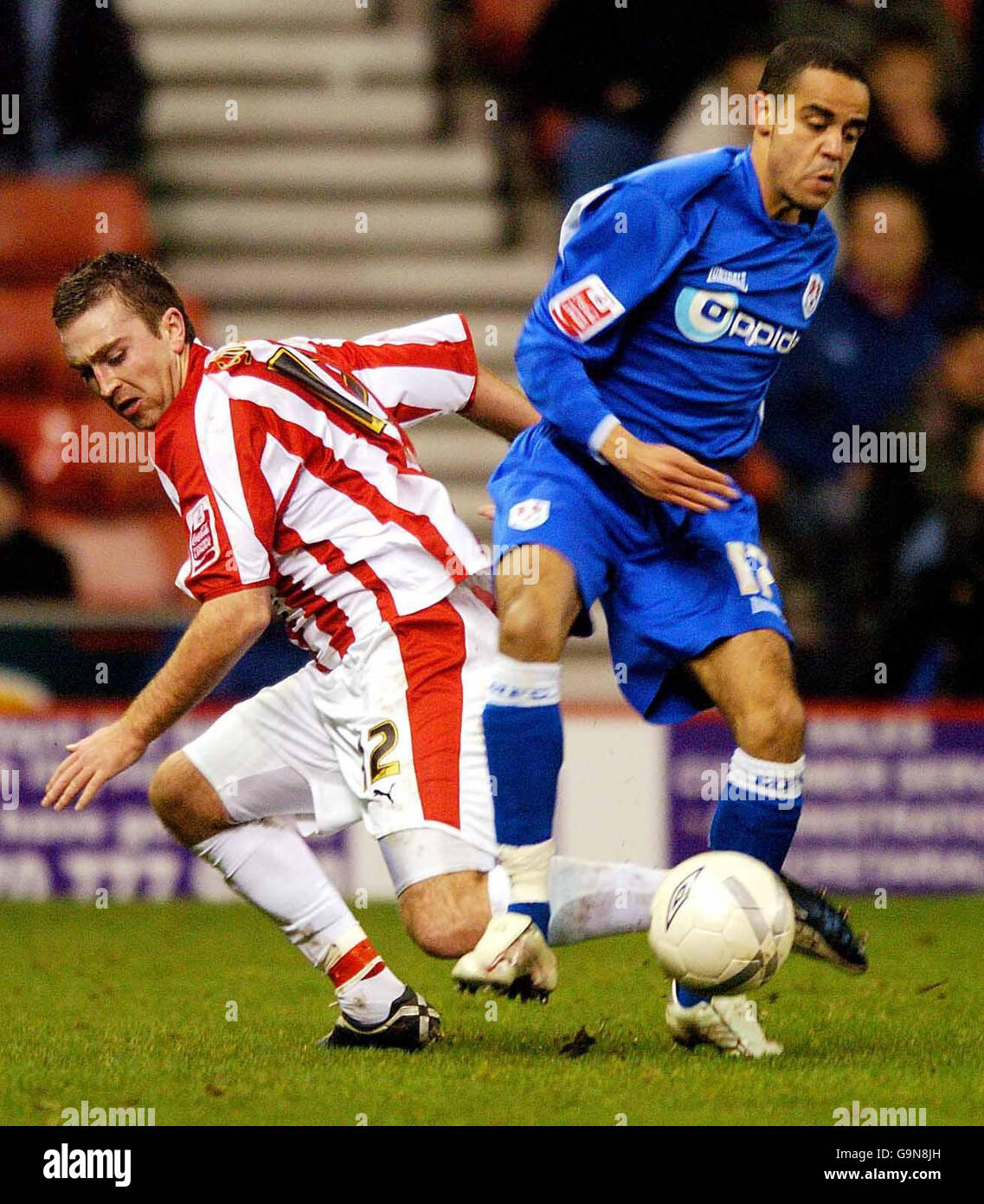 Millwall's Danny Senda (right) goes past Stoke City's Peter Sweeney ...