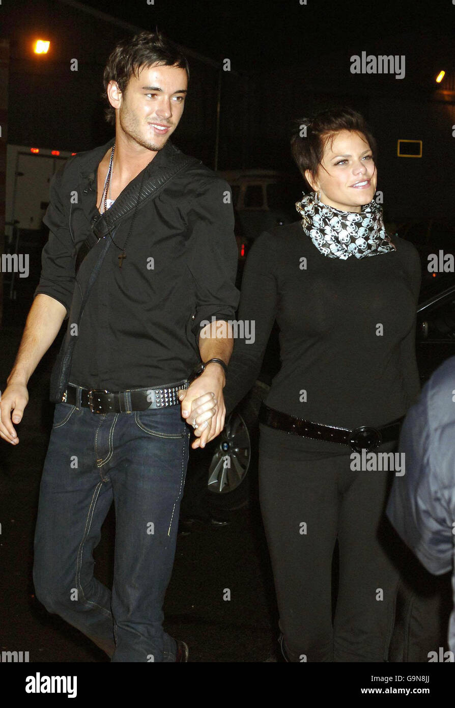 Celebrity smiling half length holding hands hi-res stock photography ...
