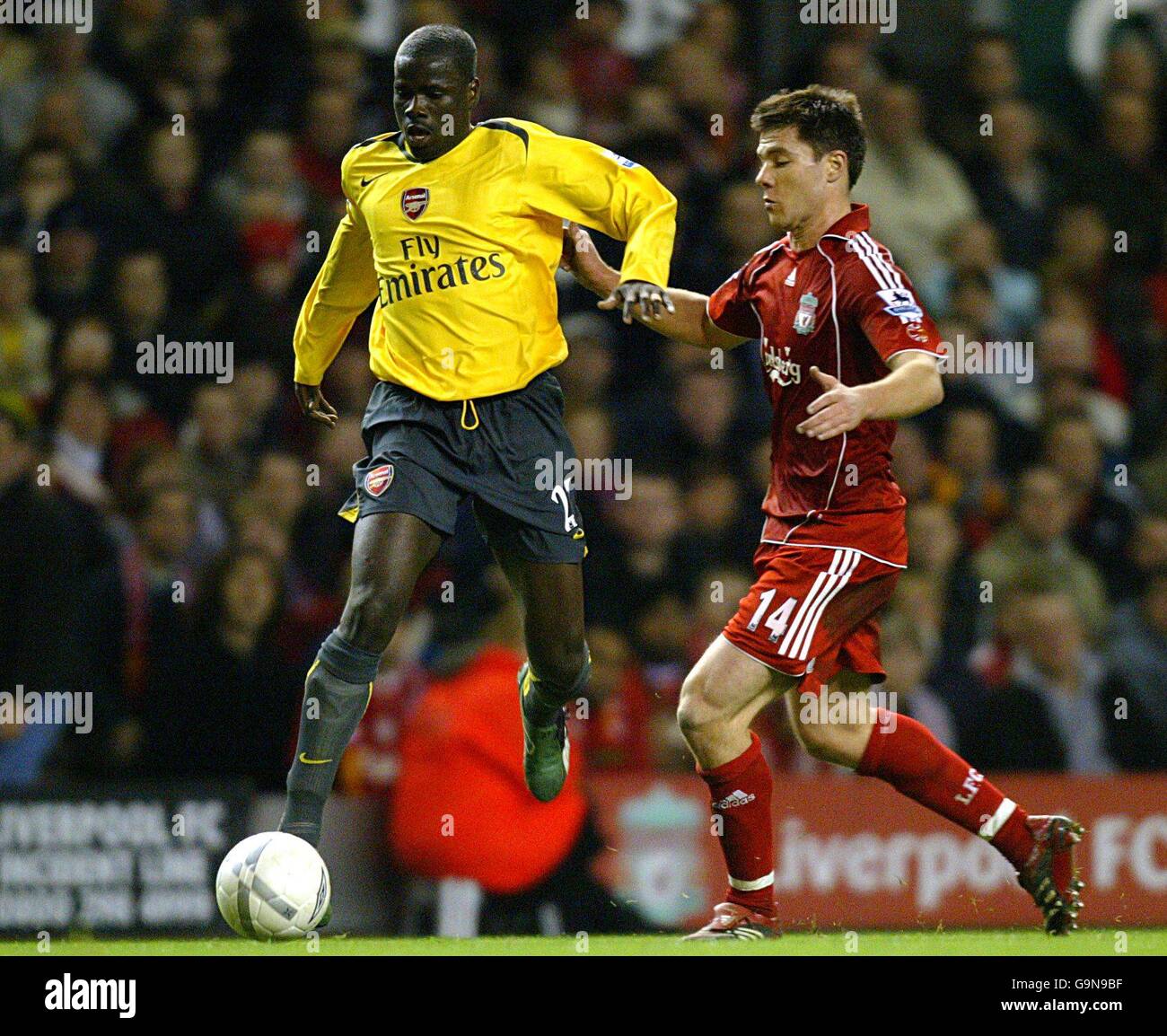 Liverpool's Xabi Alonso and Arsenal's Emmanuel Eboue battle for the ...