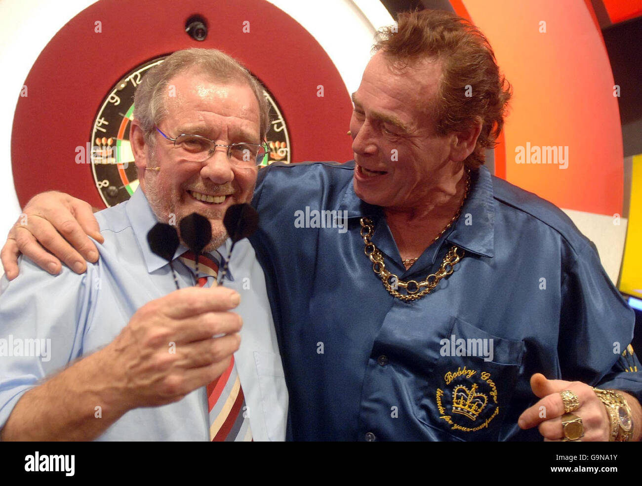 Minister for Sport Richard Caborn (left) with darts player Bobby George ...