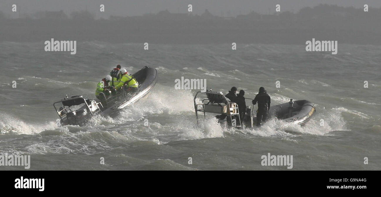 Garda and Naval divers leave Dunmore East harbour in Ireland as the ...