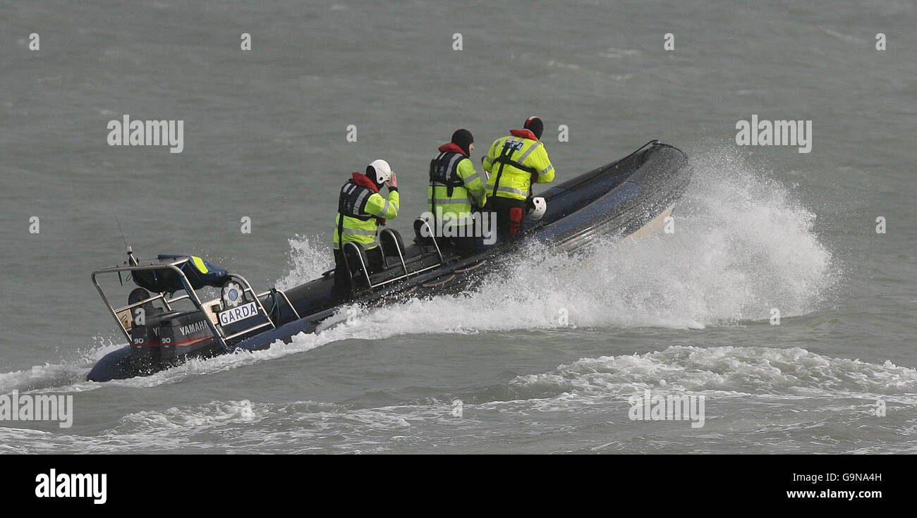 Garda and Naval divers leave Dunmore East harbour in Ireland as the ...
