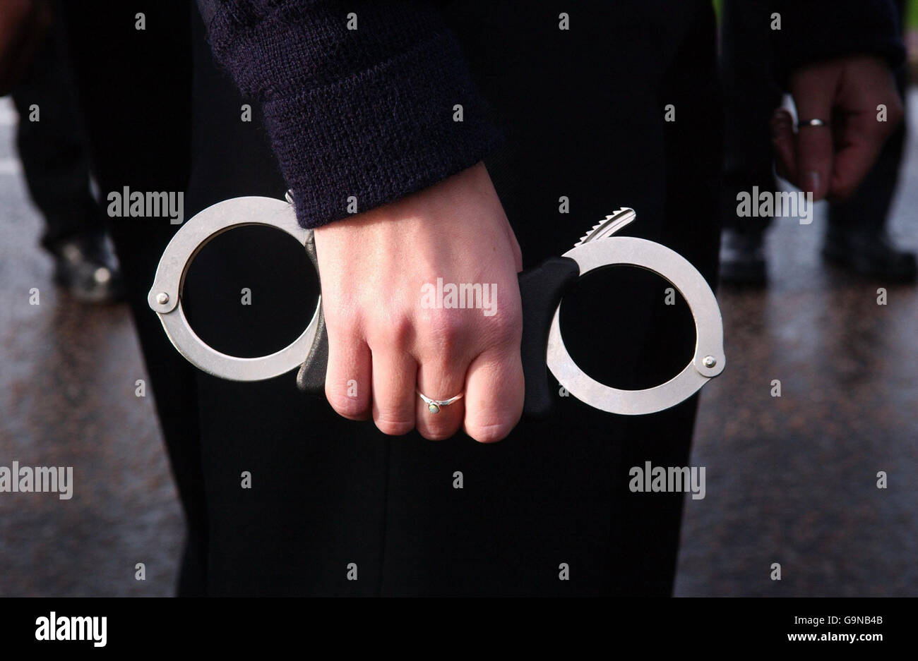 A police recruit at Hendon Police training centre in North London grips ...