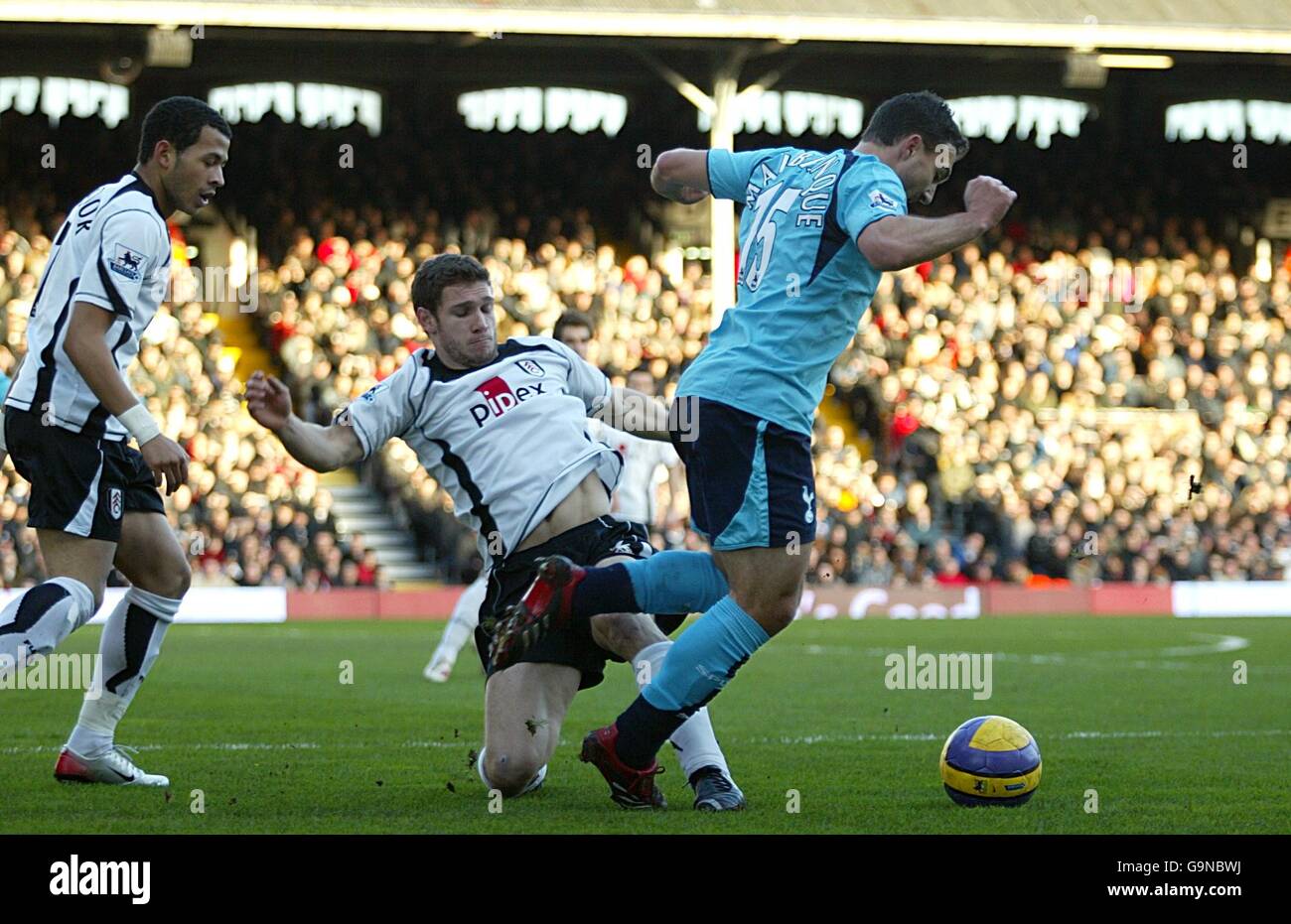 Tottenham Hotspur's Steed Malbranque (right) skips past the challenge ...