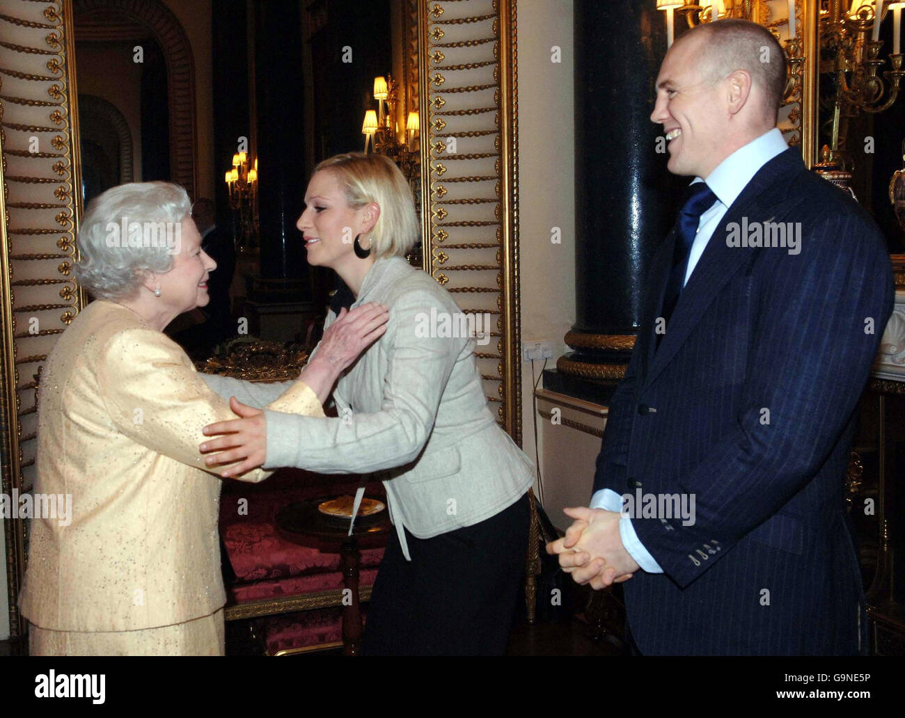 Britain's Queen Elizabeth II greets her granddaughter Zara Phillips, as ...