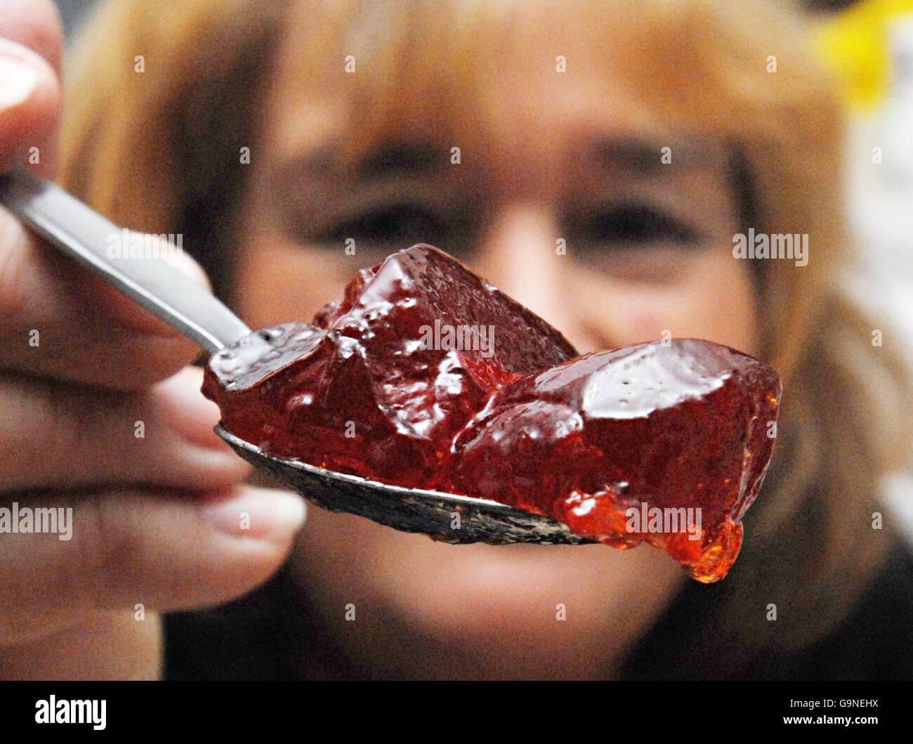 Sample of homemade Rowan Berry Jelly held by Bette Blayney at her home ...