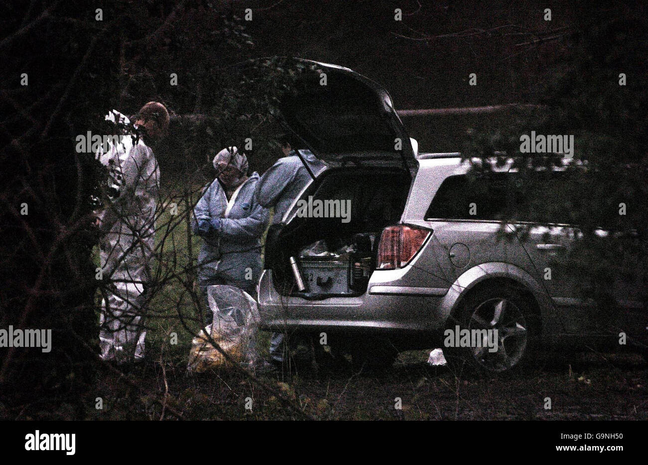 Police forensic officers gather evidence at the scene in Wanstead Park ...